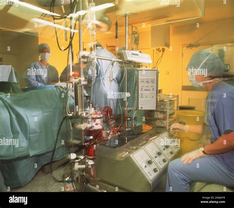 Heart Bypass Surgery Masked Surgical Team Perform A Triple Heart