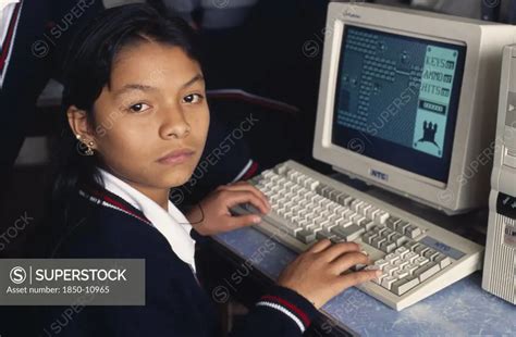 Peru Lima School Girl Learning Computer Sitting In Class Looking