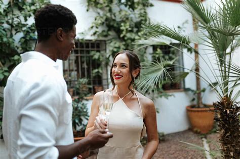 Interracial Couple Making A Toast With Sparkling Wine Happy Young