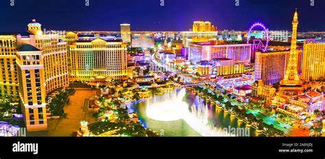 View Of The Las Vegas Boulevard At Night With Lots Of Hotels And