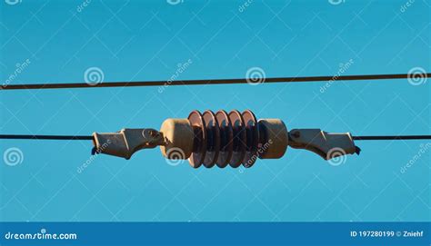 Cable And Wire With A Ceramic Insulator Against A Blue Sky Stock Image
