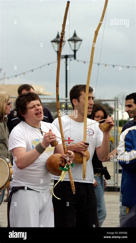 Berimbau The Brazilian Single String Instrument Being Played With A Bow The Resonating