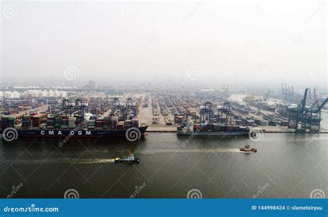 container loading and unloading at singapore shipping container terminal editorial photo