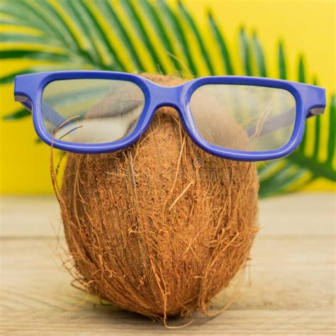 A Cocnut Wearing 3d Glasses On Blue Background Summer And Trave