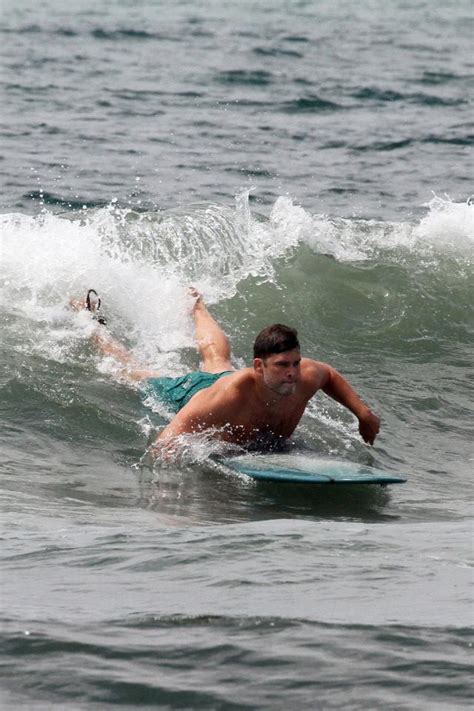 Colin Jost Spotted Surfing Shirtless In The Hamptons