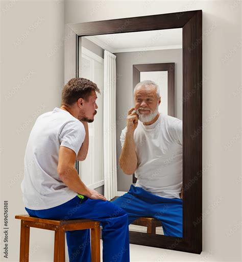 Inner Talk Man In His 30s Looking In Mirror With Elderly Reflection Of Him Senior And Young