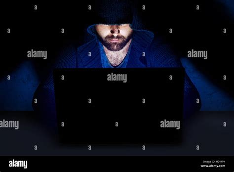 Man Working At Computer In Dark Room Stock Photo Alamy