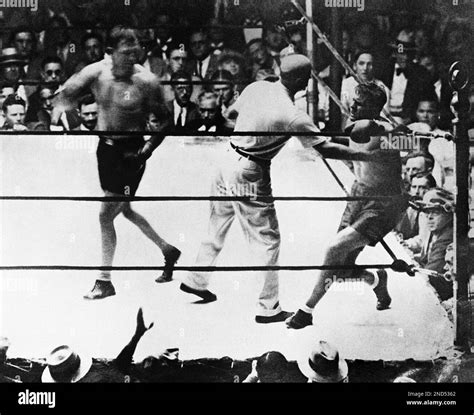 British Boxer Phil Scott Alias Philip Suffling Is Helped Up During A