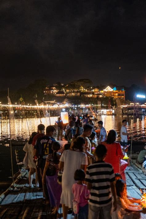A Night Festival Scene With Colorful Hot Air Balloons Lanterns And