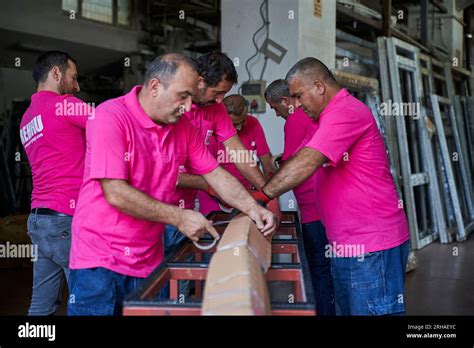 Workers Packing Cardboard Box In Warehouse For Shipment An Operator