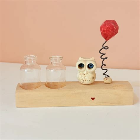 گلدان جغد دانا و موشک طرح یک فروشگاه ایدرا