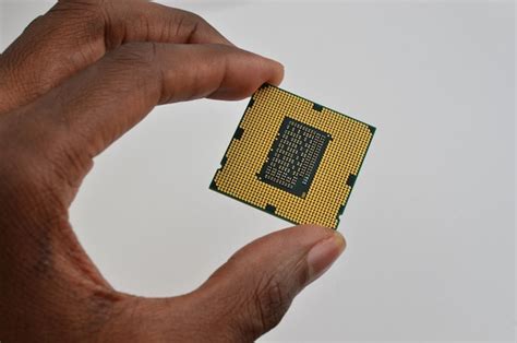 Premium Photo Impressive Closeup Of A Hand Holding A Processor Illustrating The Transformative