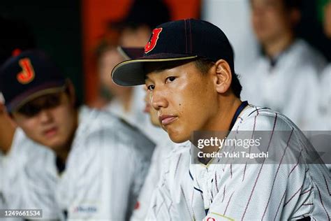 Masataka Yoshida Of Team Japan Looks On From The Dugout Prior To Game