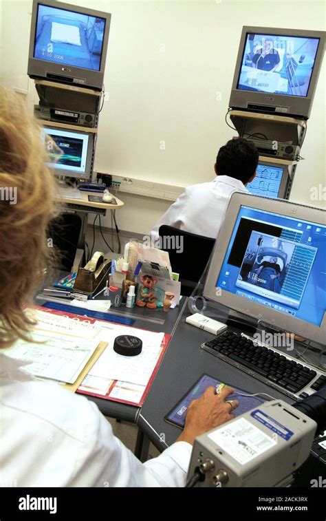 Neurological Testing Neurologists Monitoring An Epileptic Patient Undergoing An Eeg