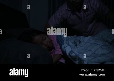 Dad And Daughter Sleep On The Bed In Bedroom Watch Cartoon With Phone