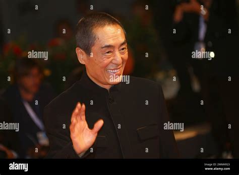 Director Zhang Yimou Poses For Photographers At The Premiere Of The