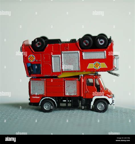 Two Stacked Toy Model Fire Trucks From The Brand Siku And Dickie Stock