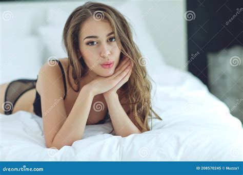 Perfect Tan Woman With Perfect Skin Big Full Lips Posing At Bedroom