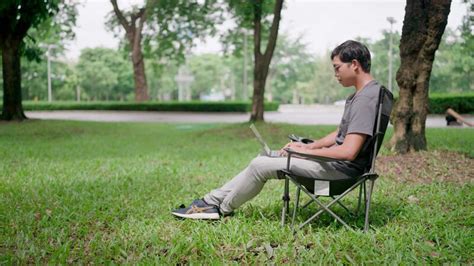 programmer in casualwear developing new software writing program code on a laptop programmer is