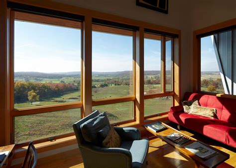 Angular Metal Roof Wraps Around Hilltop House By Demx Architecture