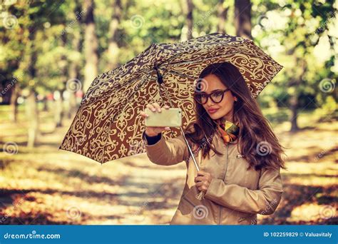 Young Beautiful Girl Makes Selfie In Autumn Park Stock Image Image