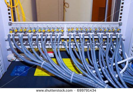 Network Cables Connected To Patch Panel On Rack Tower In Network Server Room Female RJ45 Type