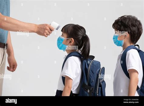 Measuring Temperature With Infrared Thermometer Before Having The Class Stock Photo Alamy