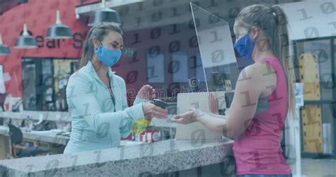 Animation Of Binary Coding Over Caucasian Female Worker With Face Mask Disinfecting Hands Stock