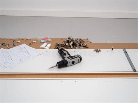 Assembly Of Furniture And Tools For Self Assembly Of Furniture On The Floor Stock Image Image