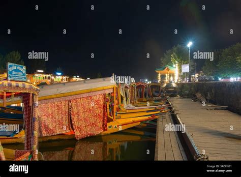 A Late Night View Of The Illuminated Floating Houseboats On Dal Lake In