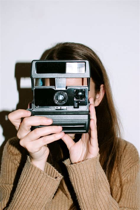 Young Woman With Vintage Polaroid Camera By Stocksy Contributor