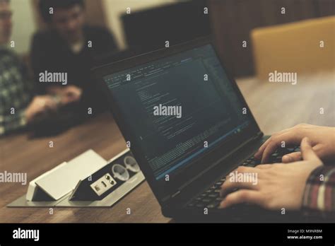 Software Developer Writing Programming Code On Laptop Computer Stock