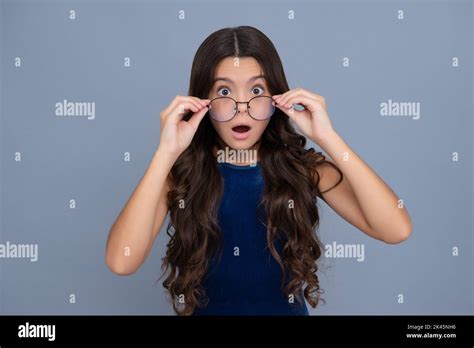 Cute School Girl Wearing Glasses On Yellow Studio Background Smart Clever Schooler Girl In