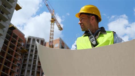 Handsome Young Male Constructor Engineer Wearing Helmet And Uniform