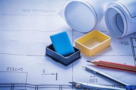 Premium Photo Composition Of Pencil Compass Eraser Rolled Blueprints