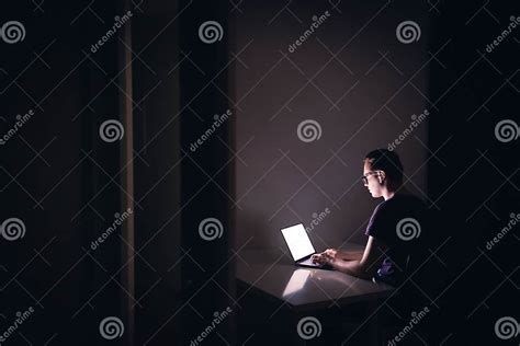 Night Work With Laptop In Dark Home Office Room Young Man Using