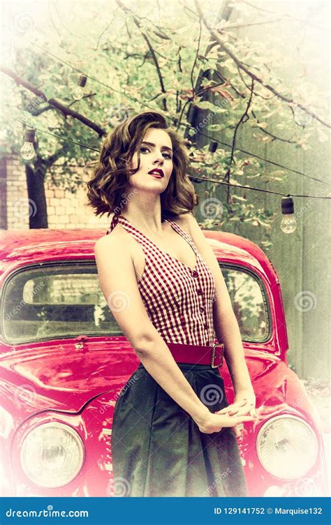 Pretty Pin Up Girl Posing On A Red Retro Car Background Playful Gaze