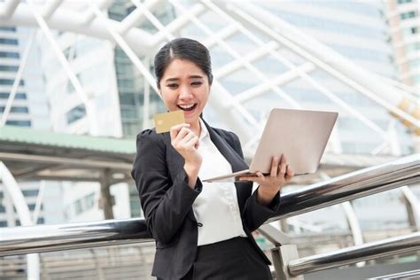 Premium Photo Woman Using Computer And Credit Card For Internet Banking