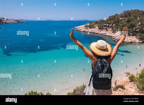 Back View Of Anonymous Female Tourist In Hat Celebrating Summer Holiday