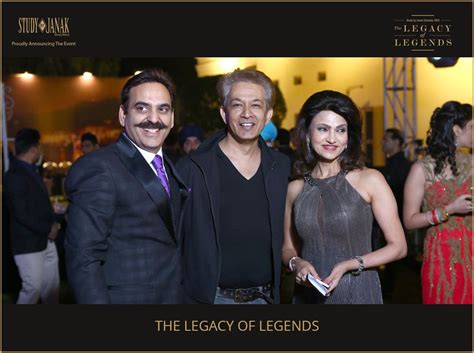 Three People Standing Next To Each Other At An Event