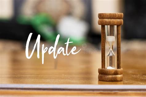 Sand Running Through The Bulbs Of An Hourglass With Update In Loading