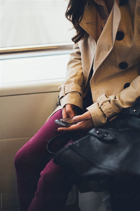 Woman Playing Games On The Bus By Stocksy Contributor Lumina Stocksy
