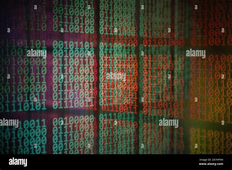 Double Exposure Image Of Computer Screen Displayed Lines Of Binary Code