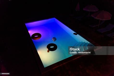 A Night Shot Of A Private Residential Swimming Pool With Underwater