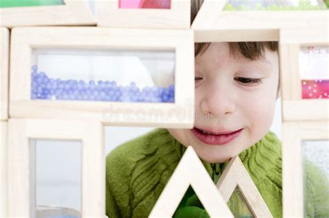 Boy Plays With Different Shape And Color Sensory Blocks Stock Image