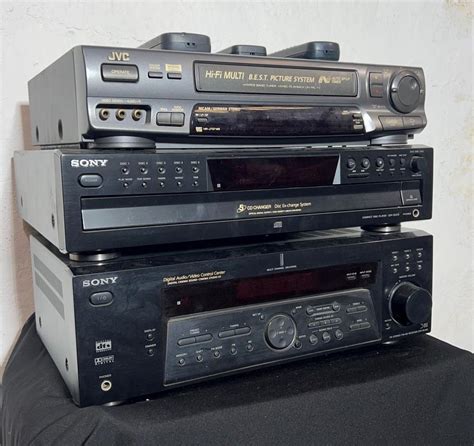 Lot A Sony Amp Cd Player Dual Cassette Deck Speakers Jvc Vhs Player Three Remotes And An