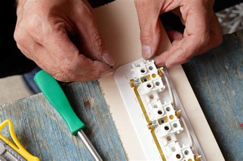 Premium Photo Man Making An Extension Cord Socket Outdoor