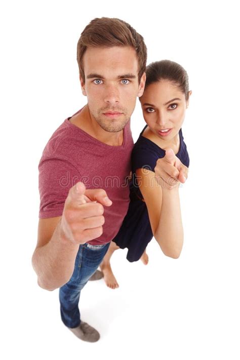 Try To Resist Pressing The Button High Angle Shot Of An Attractive Couple Pointing Upwards