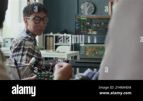 Multiethnic Group Of Gen Z Boys And Girls Having Programming And