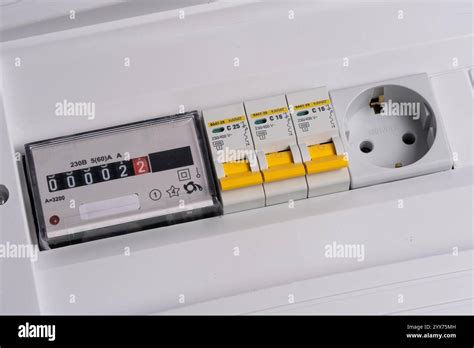 Electricity Meter And Automatic Disconnection Machines With An Outlet In White Shield Stock